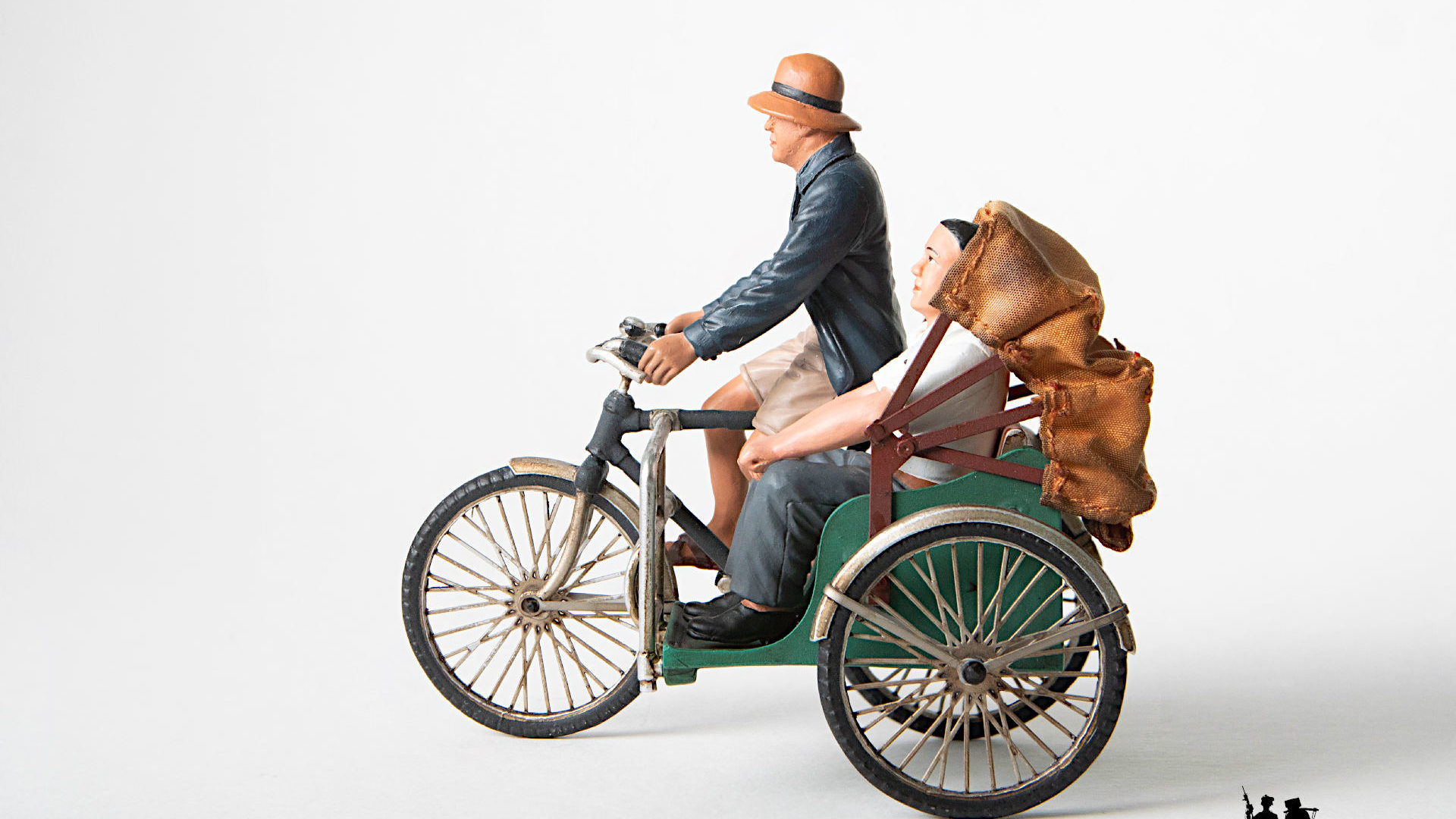 Hand-painted miniature figurine of a trishaw rider from 1950s Singapore